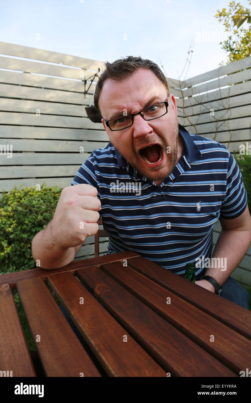 Angry Man Drinking Stock Photo - Alamy