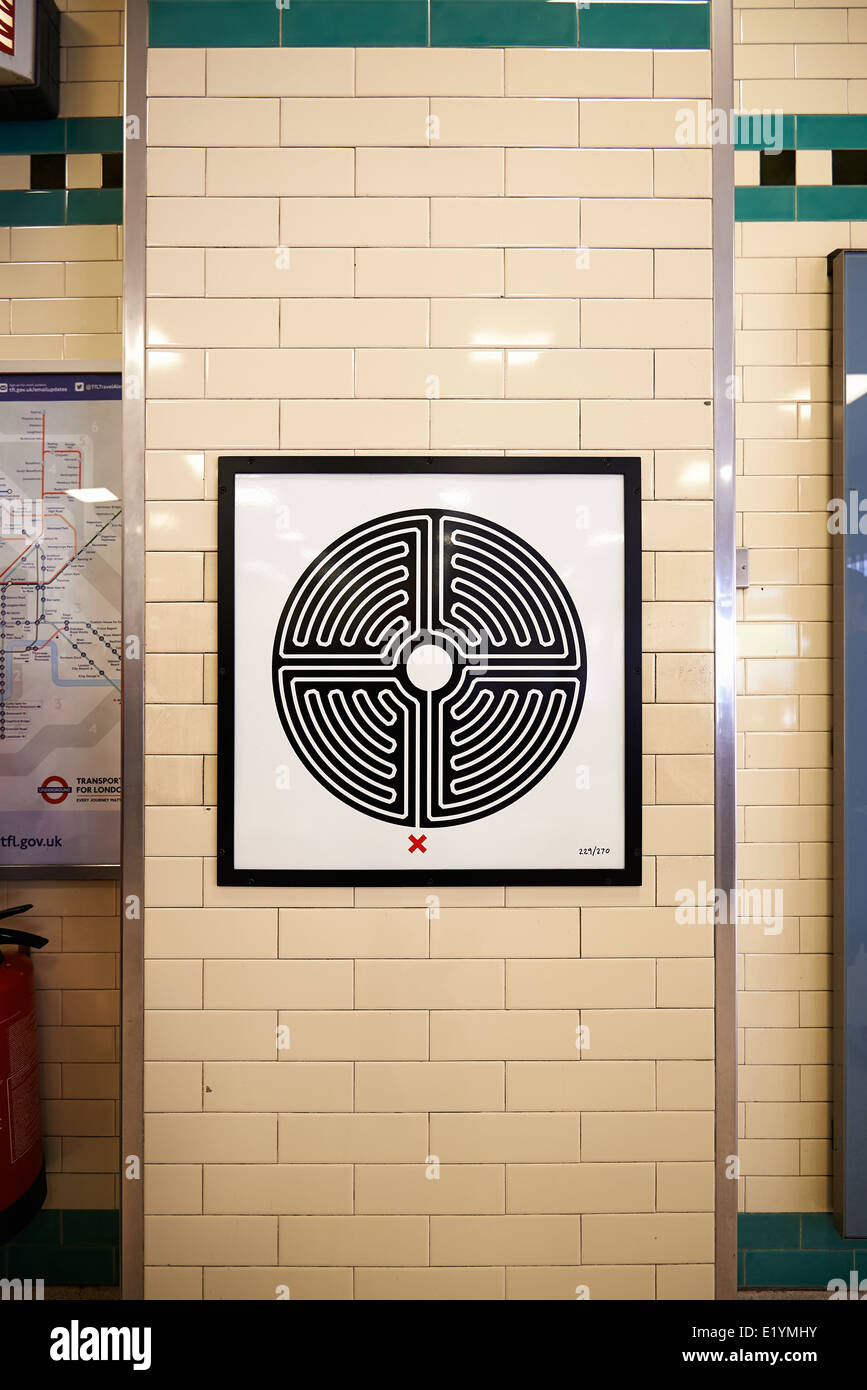 Assembly point sign in the underground metro of London Stock Photo - Alamy