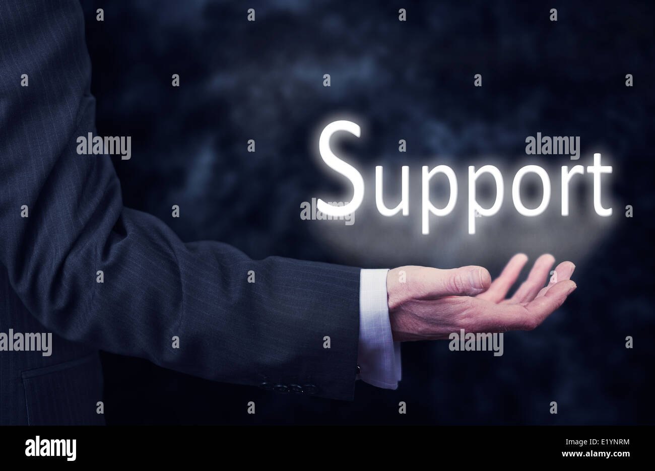 A businessmans hand holding the word, Support Stock Photo - Alamy