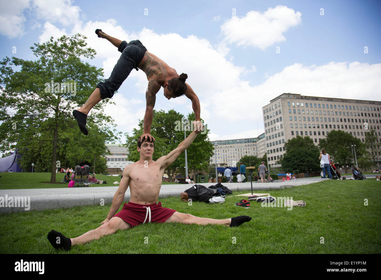 Acrobats practice their strength hand balancing act in Jubillee Gardens ...