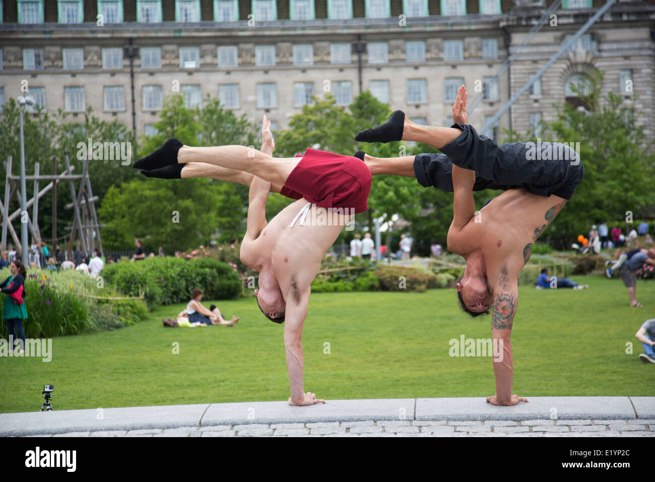 Acrobats practice their strength hand balancing act in Jubillee Gardens ...