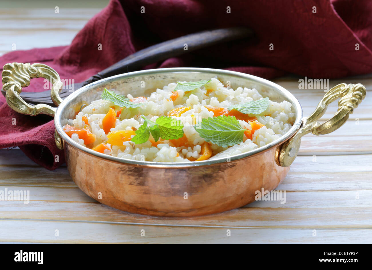 rice with vegetables cooked in Indian style in a copper pan Stock Photo ...
