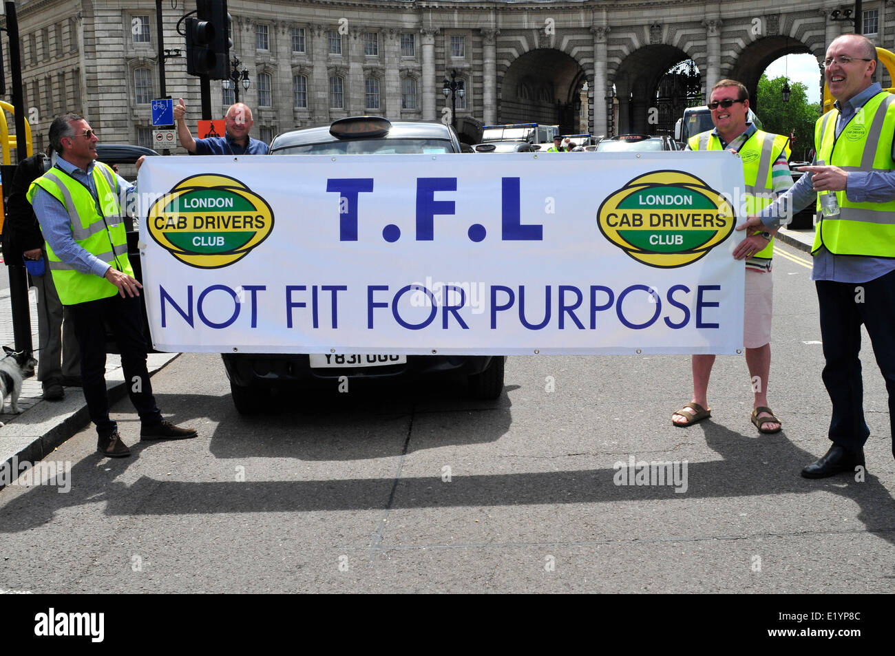 Black cab drivers hold a banner reading " TFL not fit for purpose Stock ...