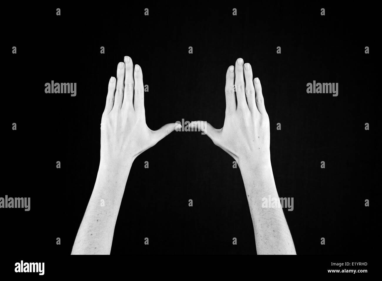 Two hands reaching high Stock Photo - Alamy