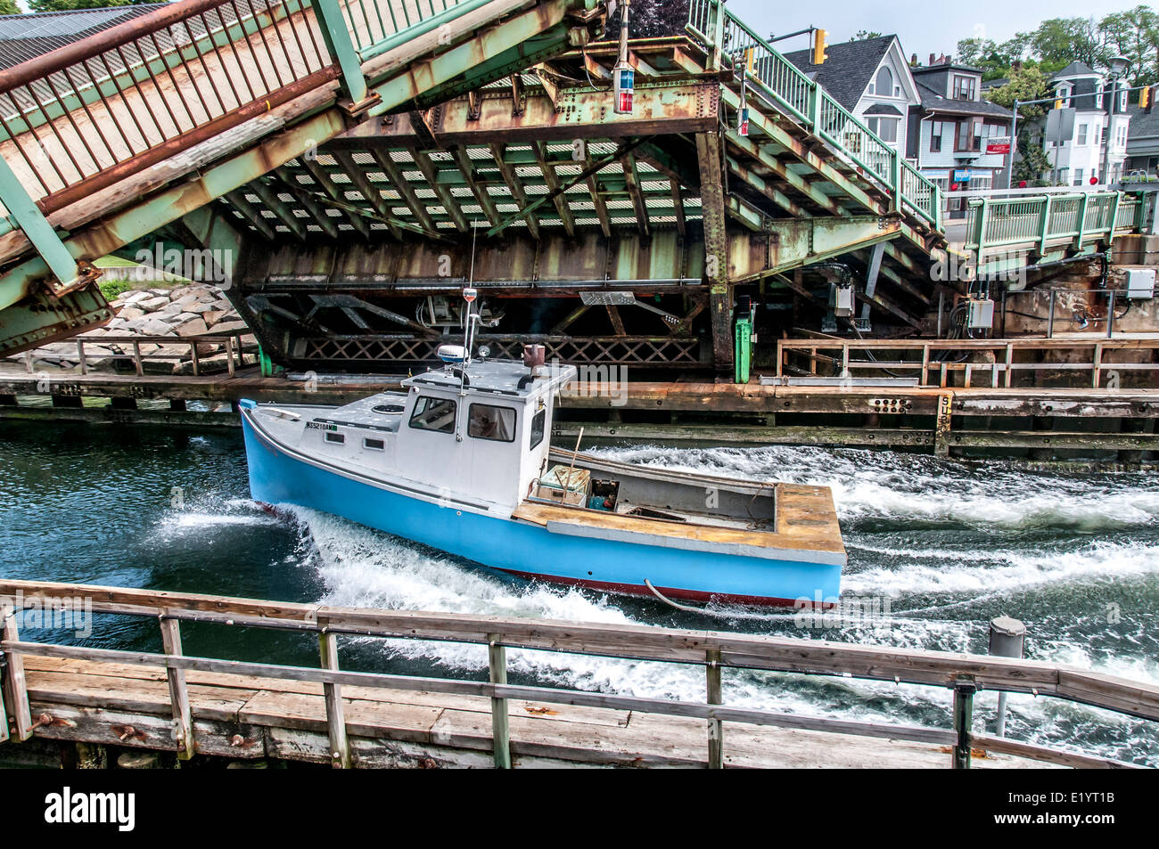 The Drawbridge goes up to allow a lobster boat to head into canal to ...