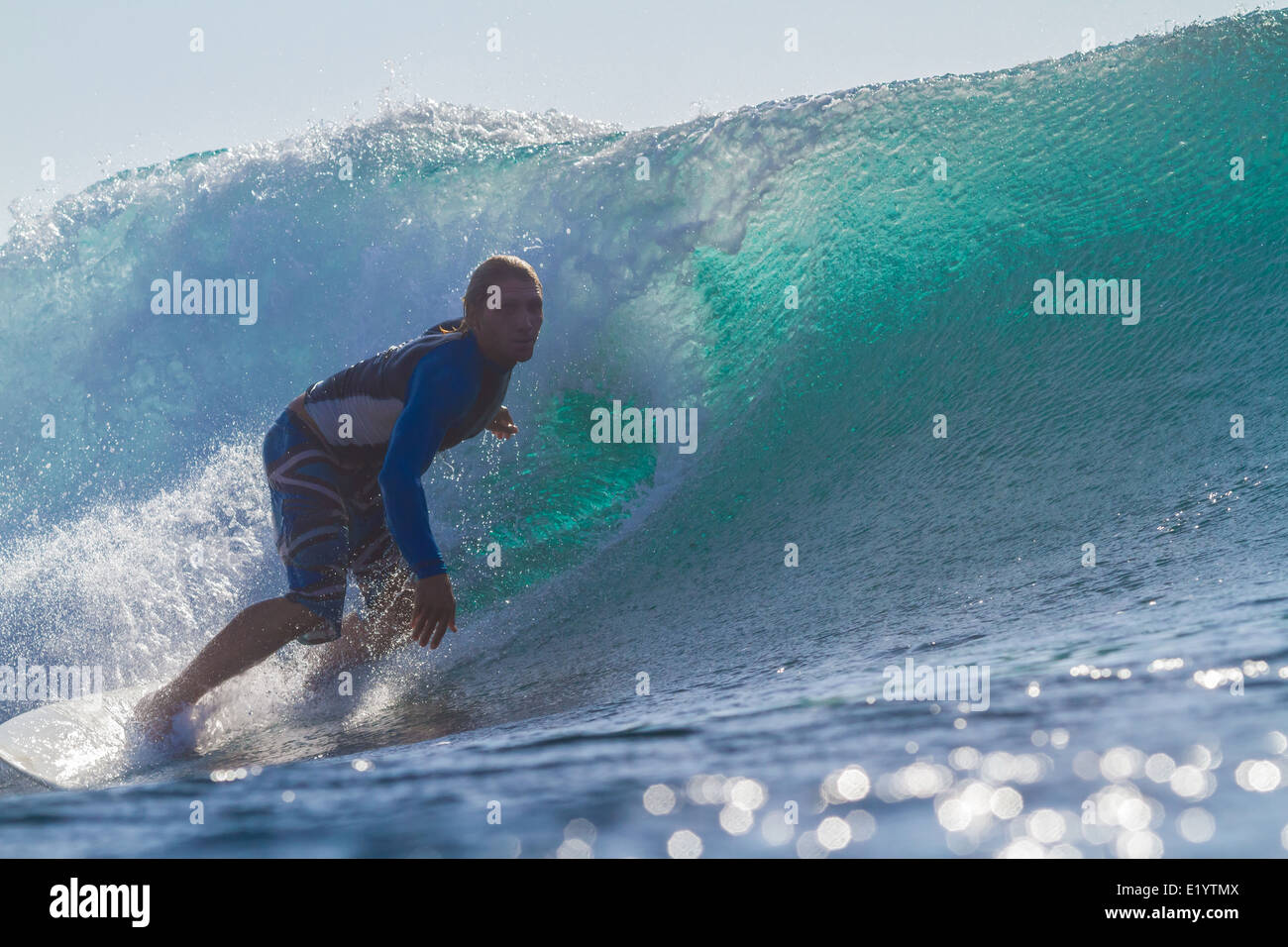 Surfing a wave Stock Photo - Alamy