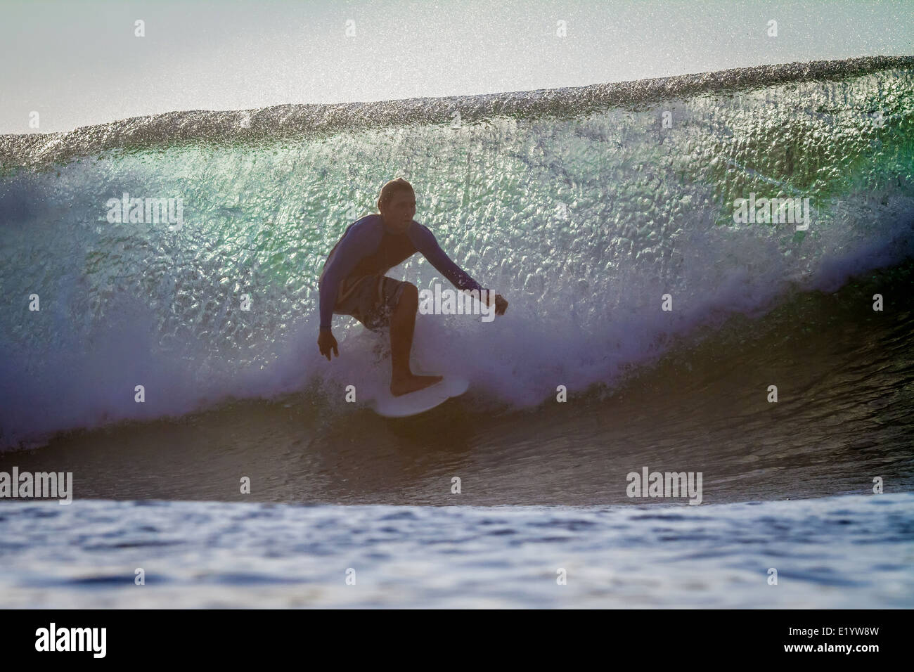 Surfing a wave.Indonesia Stock Photo - Alamy