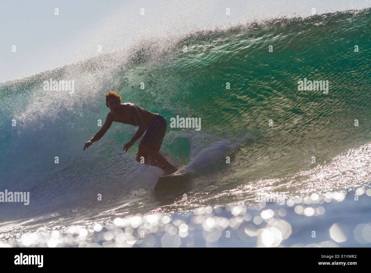 Surfing a wave Stock Photo - Alamy