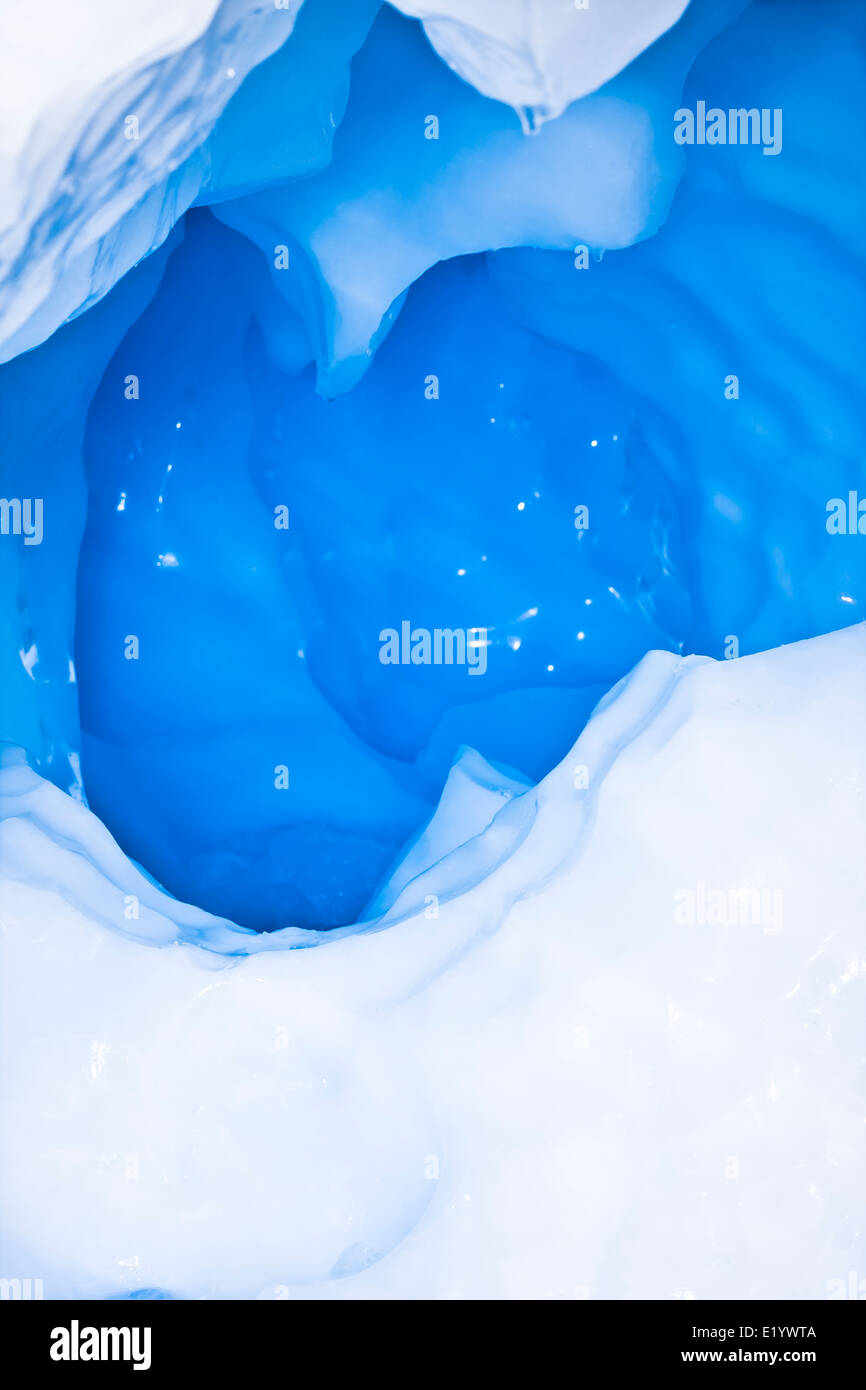 Large Arctic iceberg with a cavity inside Stock Photo - Alamy