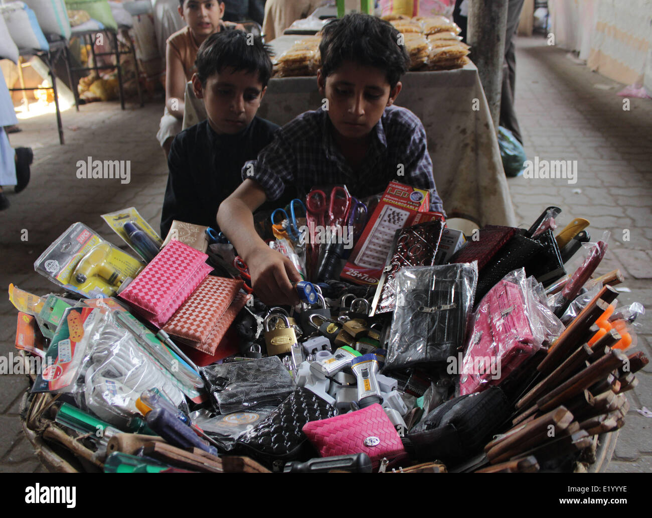 Lahore, Pakistan. 11th June, 2014. Pakistani child busy in their works ...