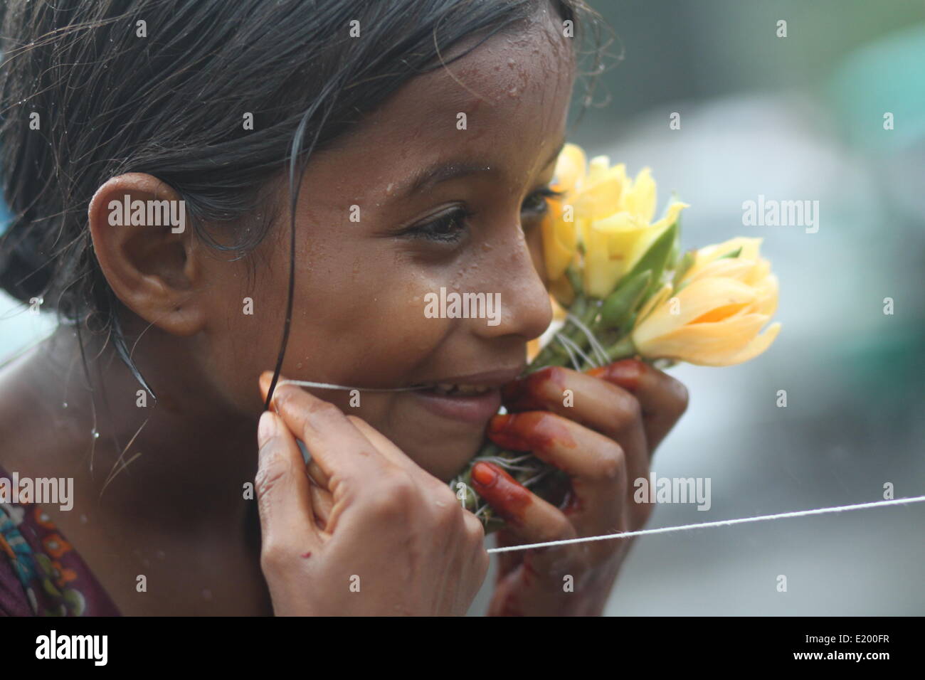 Shila a flower saller sell his flowers on street. In Bangladesh over a ...
