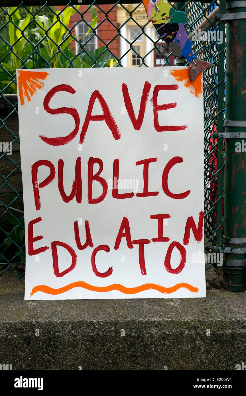 A protest sign hangs outside Lord Tennyson Elementary School in ...