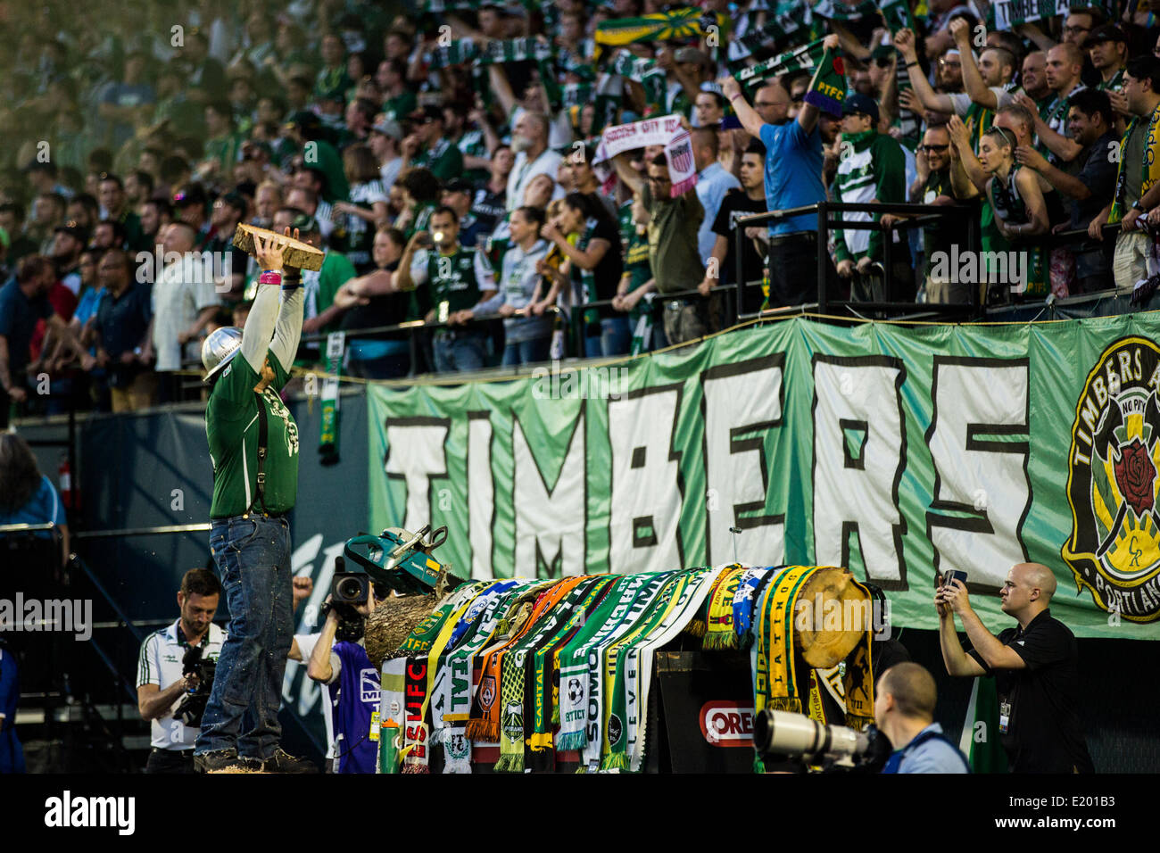 Timber Joey holds up a log slice after WILL JOHNSON scores a goal. The ...