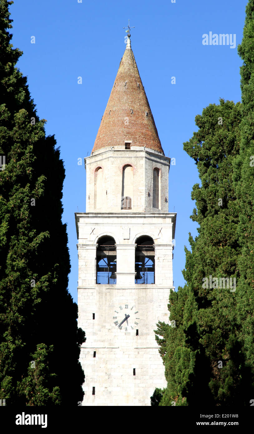 ancient Bell Tower of the ancient city of AQUILEIA among tall cypress ...