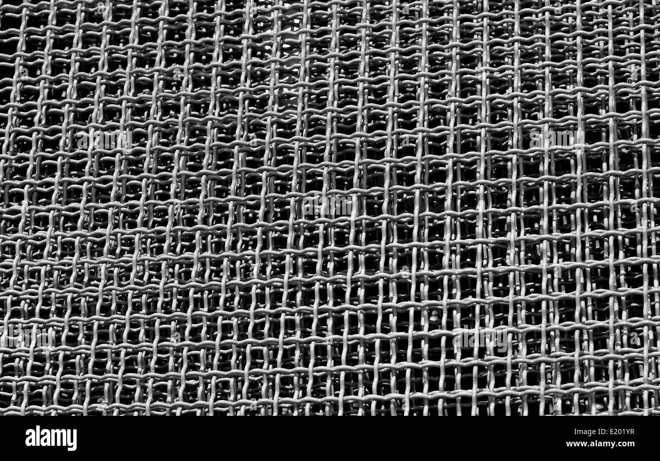 uniform background a dense grey metal grill pattern Stock Photo - Alamy