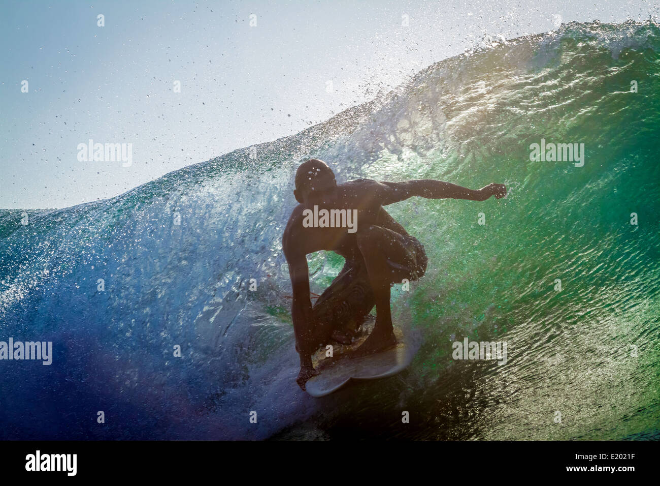 Surfing a wave Stock Photo - Alamy