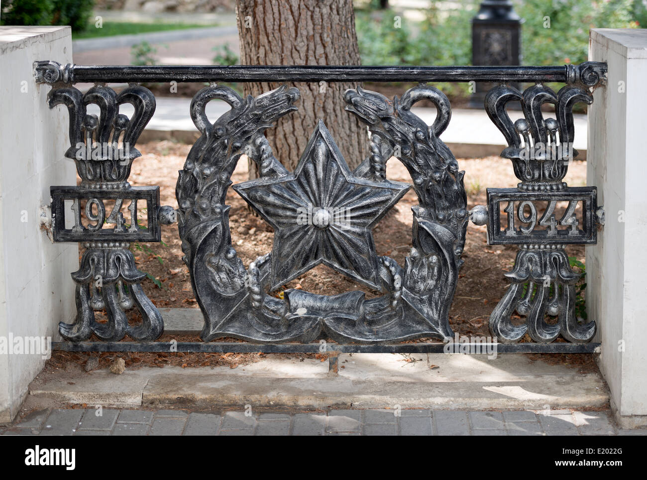 Metal park fence of old soviet style in public gardens on the seafront ...