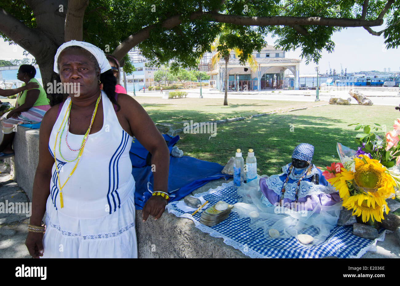 Havana Cuba Santeria woman in white with doll with African religion and ...