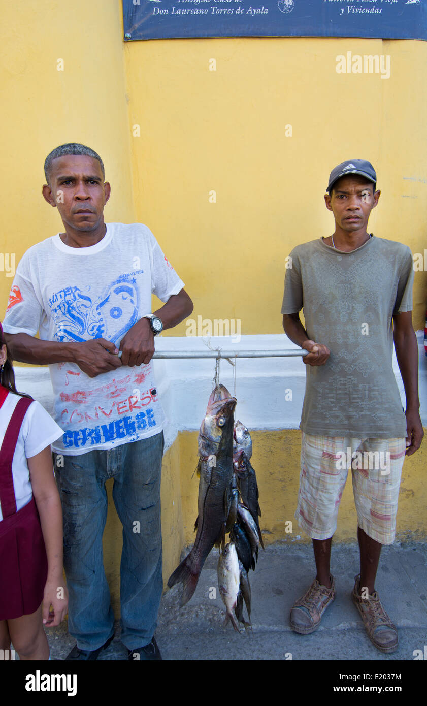 Cuba Havana Habana two men with fish from river in Old Havana Stock ...