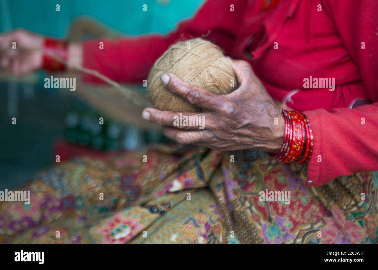 Nepal. Nepali weaving woman, posing and weaving threads for carpets ...