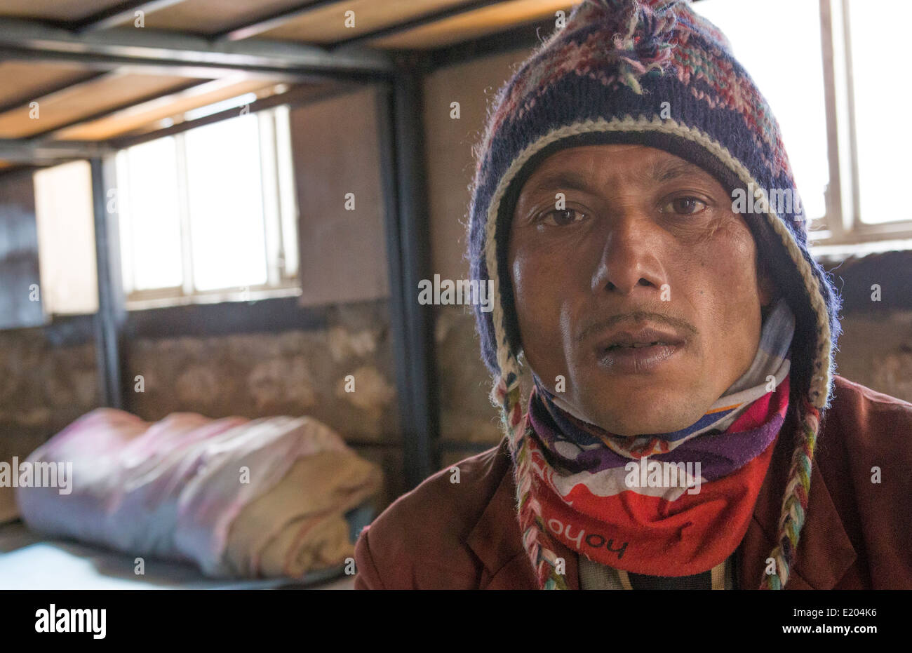 Nepal Porter poses for portrait inside porter house in Namche Bazarre ...