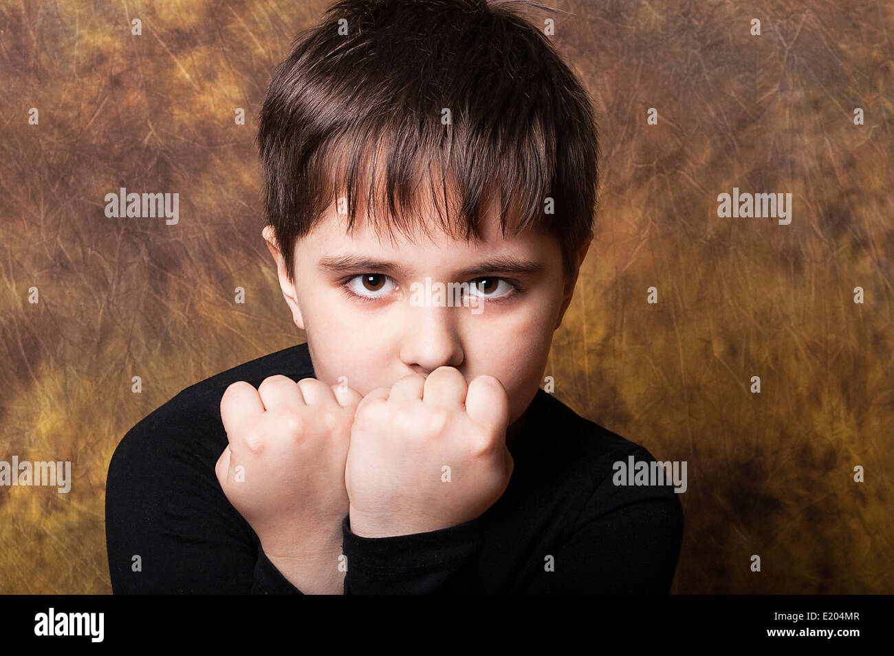 aggressive boy of seven, studio shot Stock Photo - Alamy