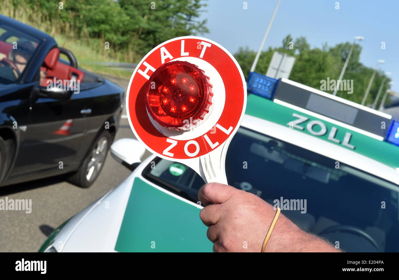 Iffezheim, Germany. 12th June, 2014. Customs officers hold cross-border ...