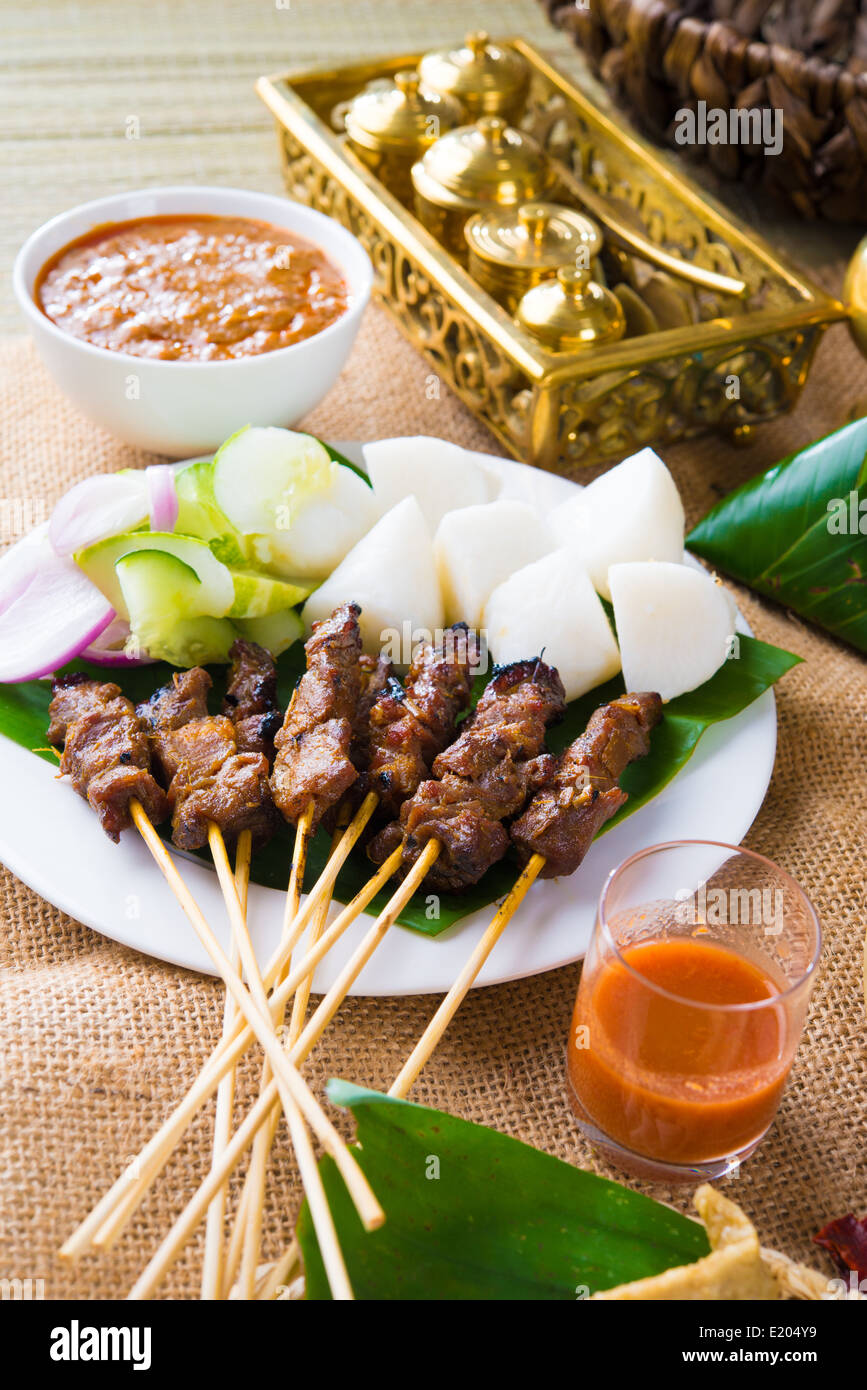 beef satay with traditional background setting Stock Photo - Alamy