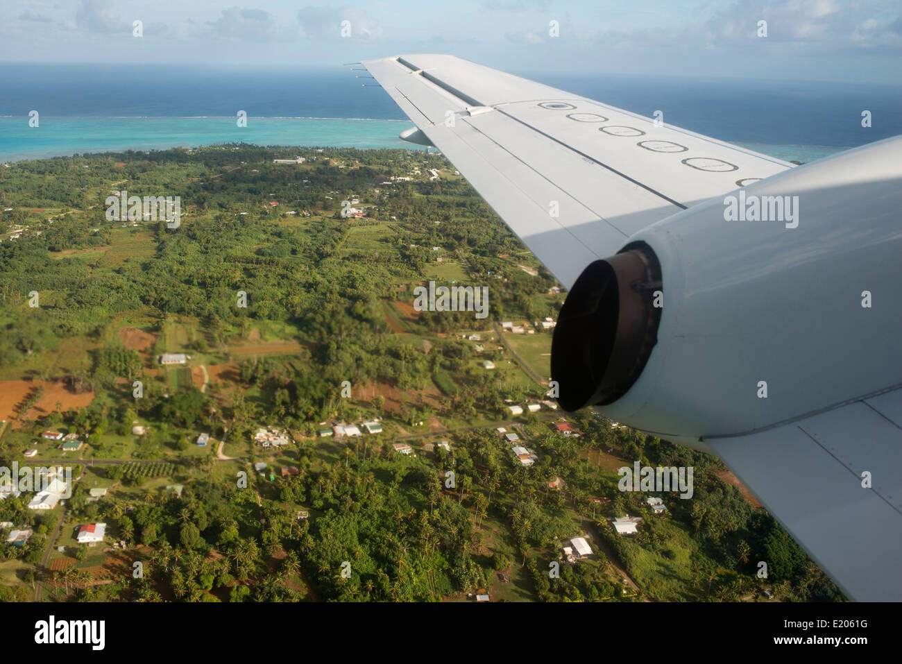 Aitutaki. Cook Island. Polynesia. South Pacific Ocean. A plane flies ...