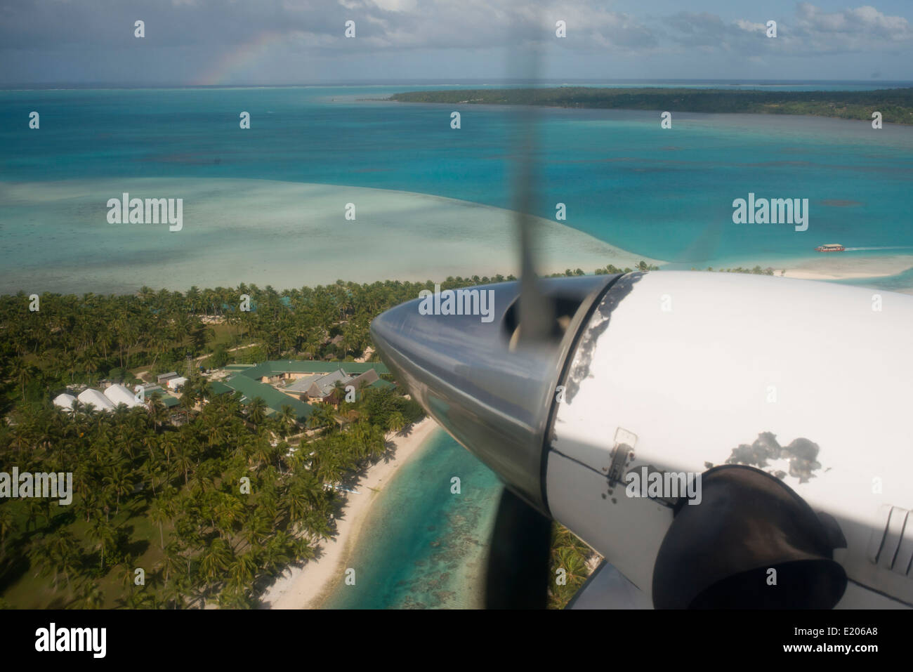 Aitutaki. Cook Island. Polynesia. South Pacific Ocean. A plane flies ...