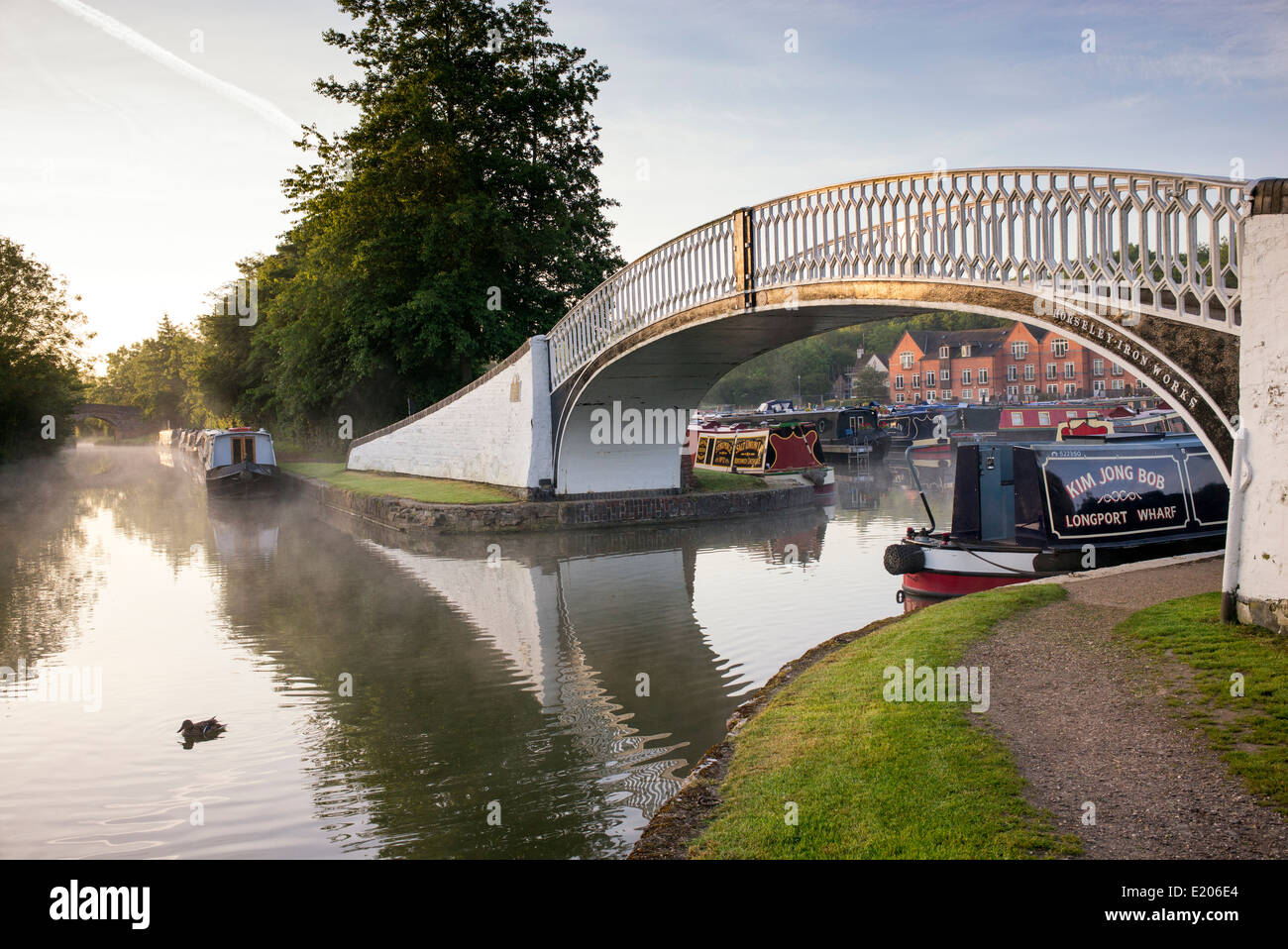 Narrowboats and iron footbridge at Braunston Marina on the Grand Union ...