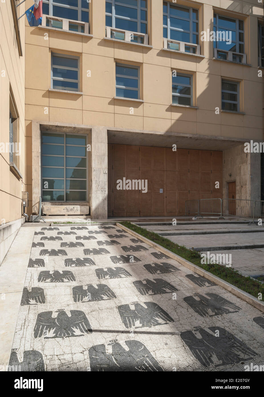 Entrance to a school with a marble mosaic, eagle wearing a crown ...