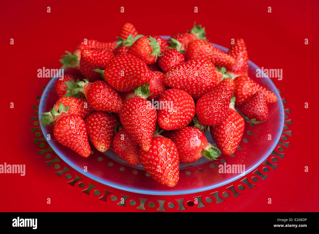 Strawberries in plates background hi-res stock photography and images ...