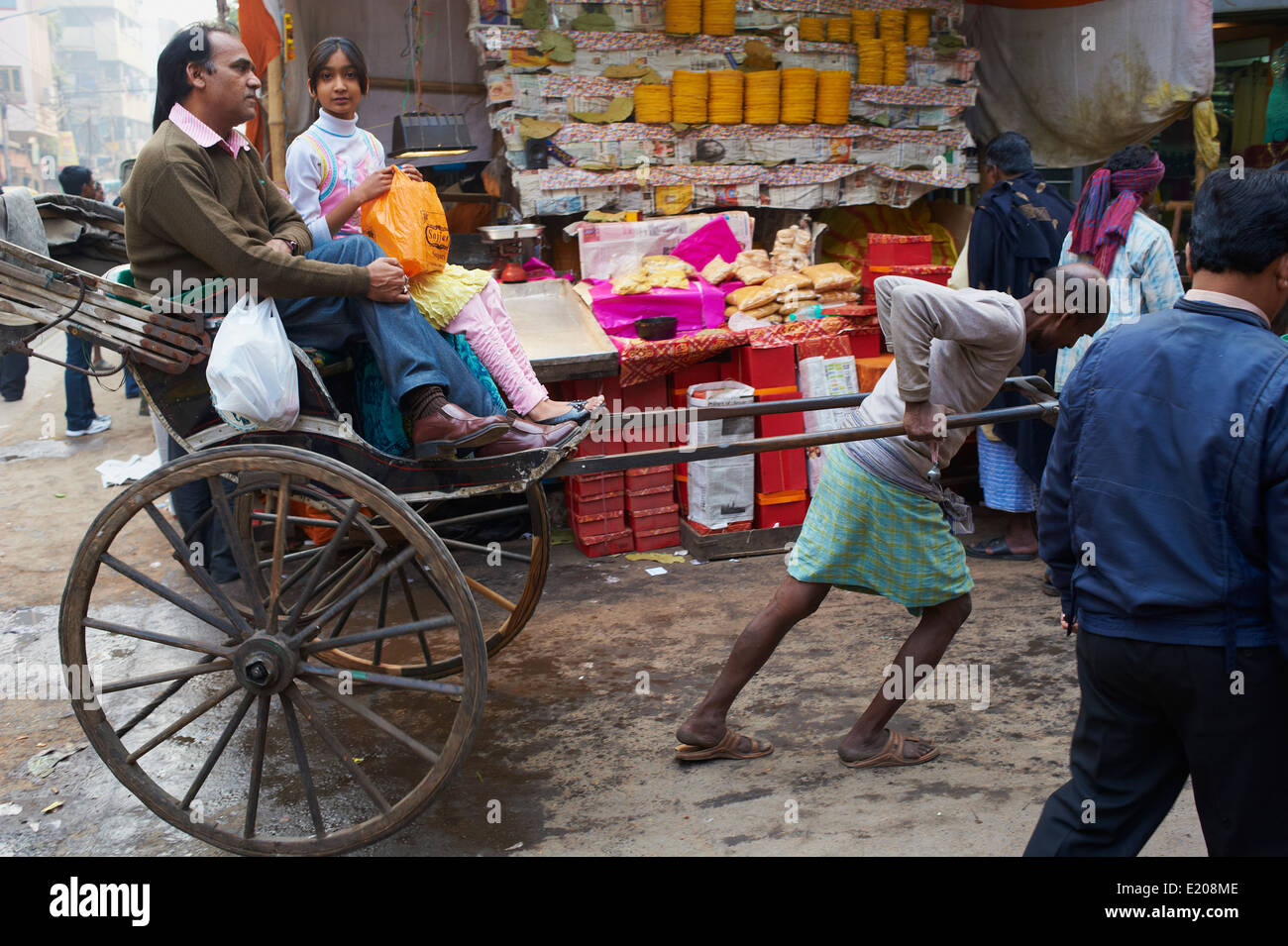 Pulling rickshaw calcutta hi-res stock photography and images - Alamy