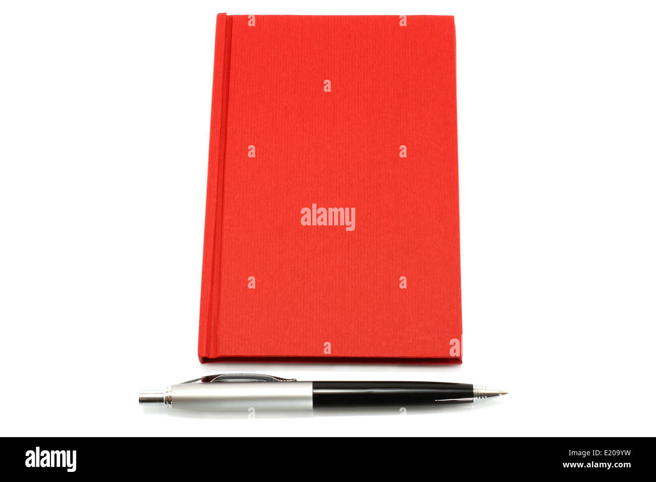 Red notepad with ball pen on a white background Stock Photo - Alamy