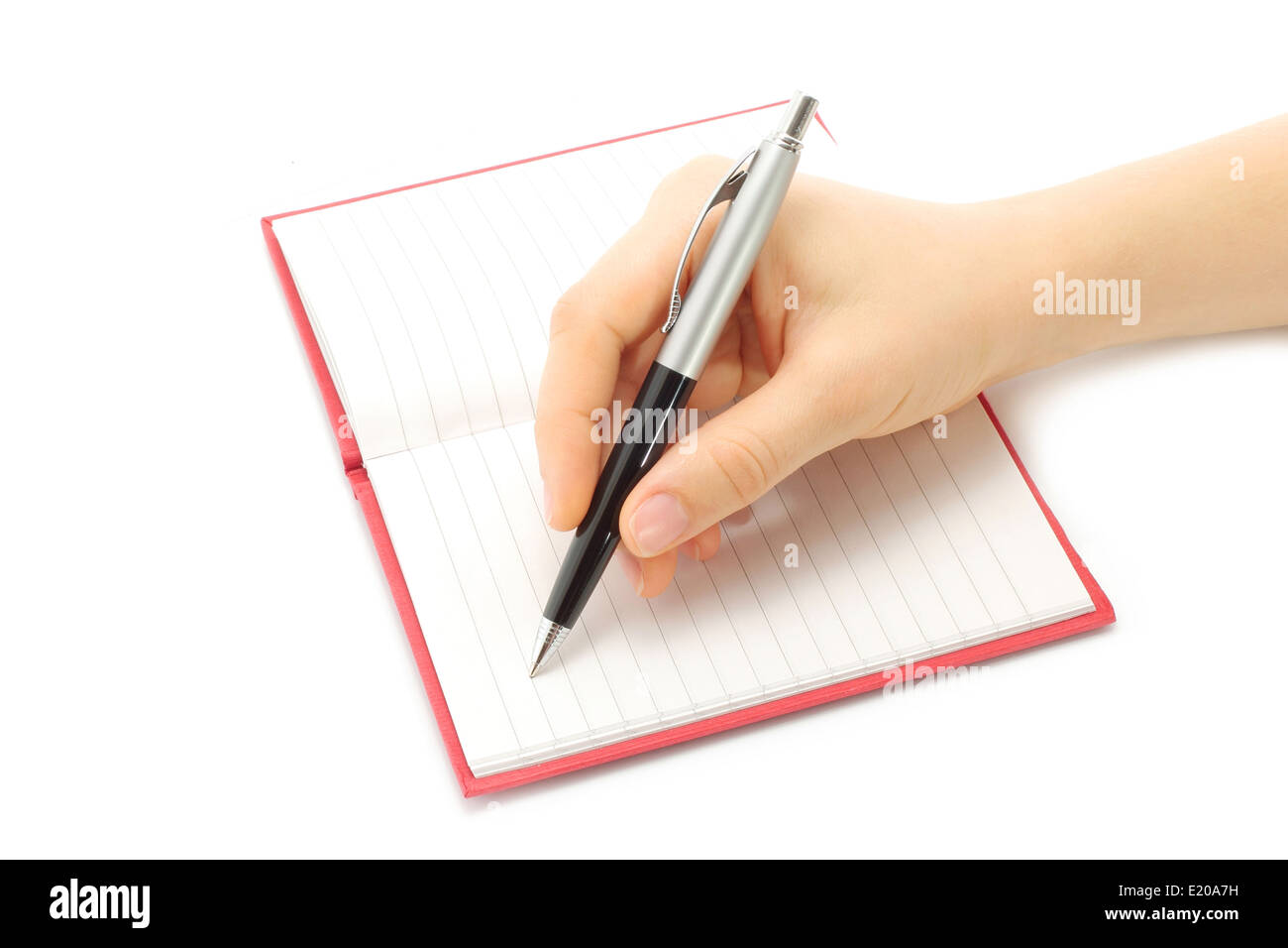 Writing woman hand in notepad on a white background Stock Photo - Alamy