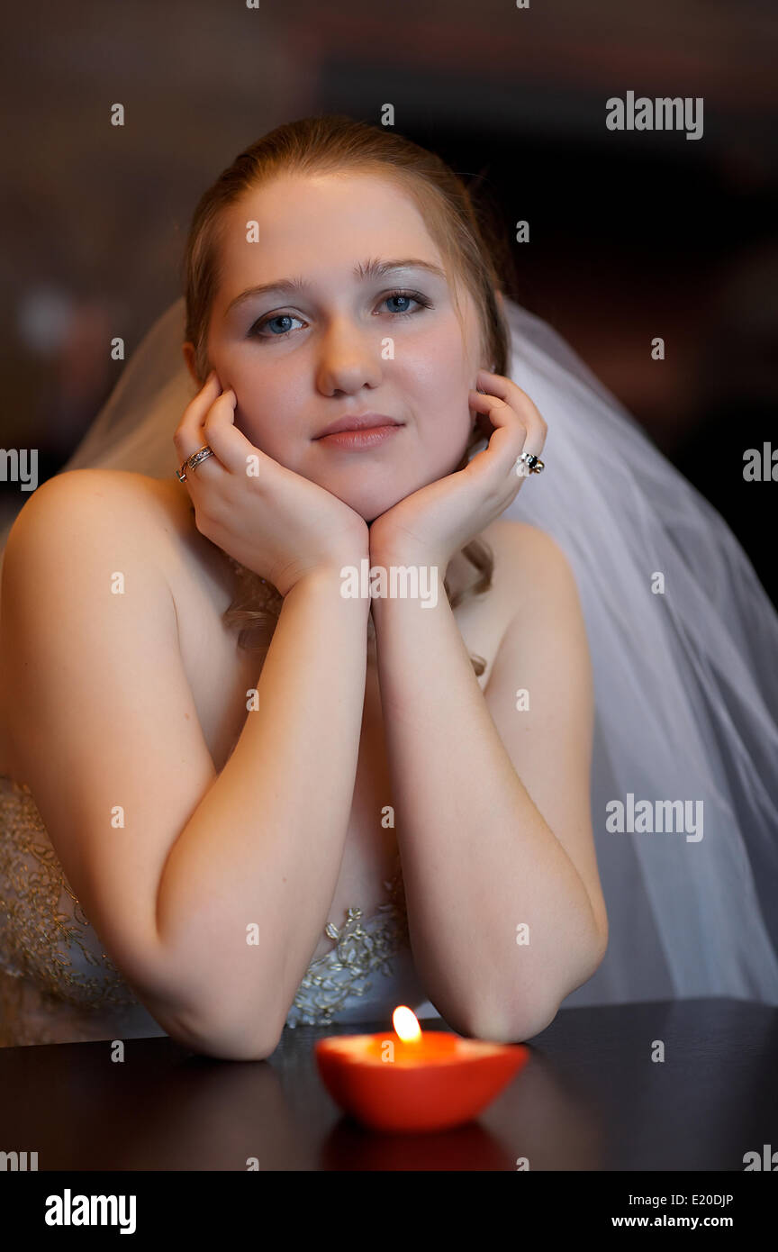 Bride and candle Stock Photo - Alamy
