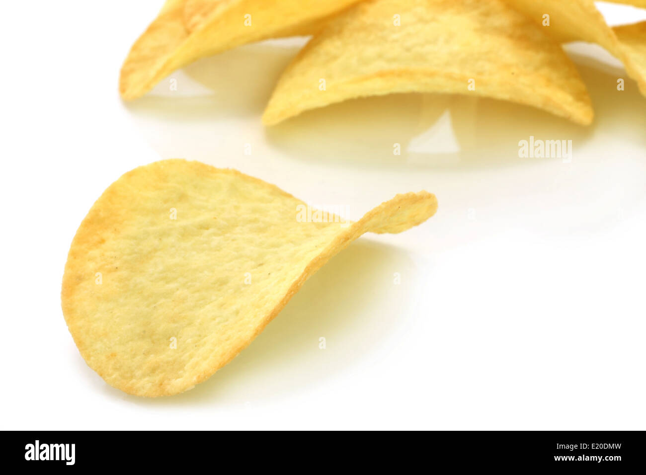 Heap of potato chips on a white background Stock Photo - Alamy