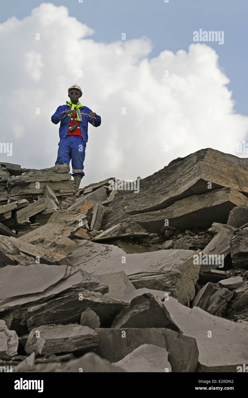 FQM copper mine employee standing proudly above a pile of rocks Stock ...