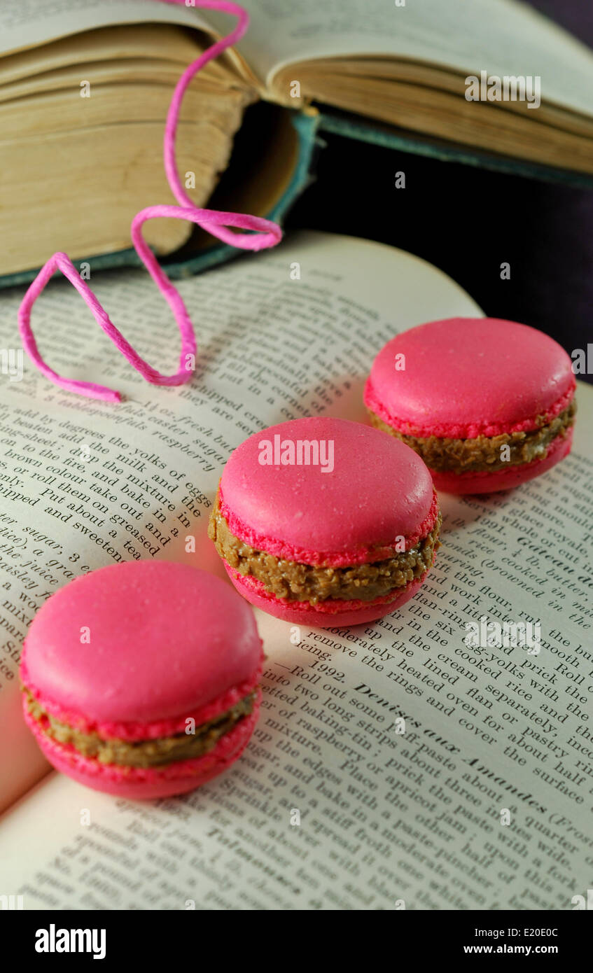 Macaroon on antique recipe book Stock Photo - Alamy