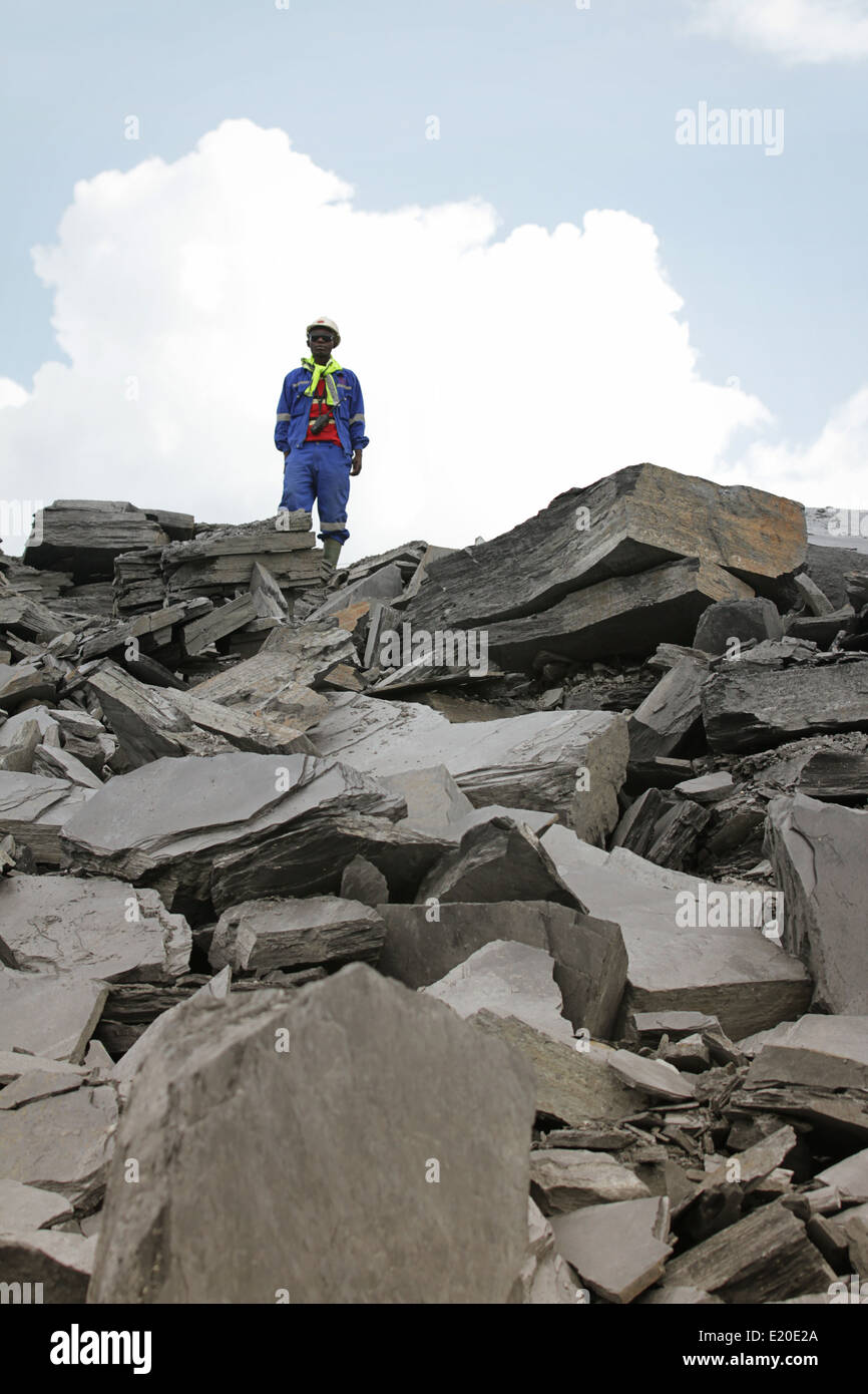 FQM copper mine employee standing proudly above a pile of rocks Stock ...