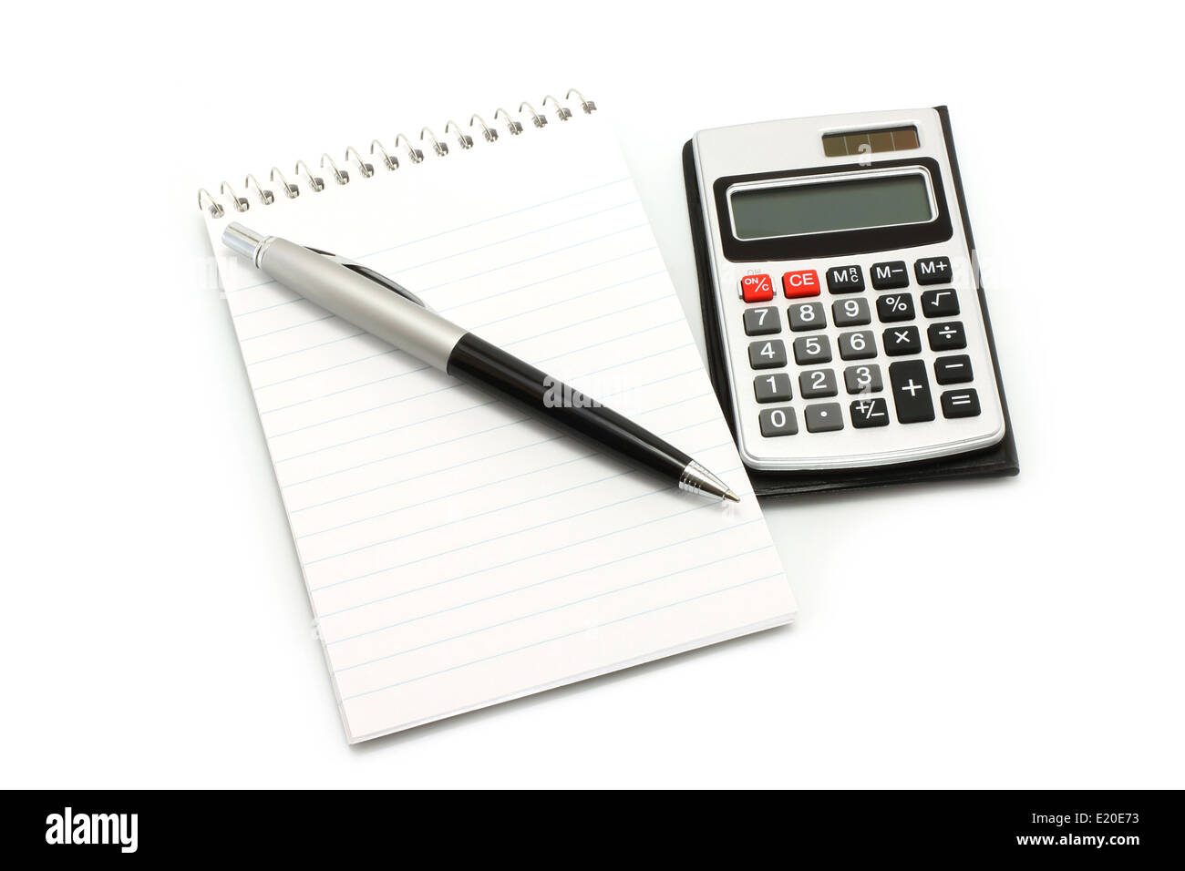 Notepad with ball pen and calculator on a white background Stock Photo ...