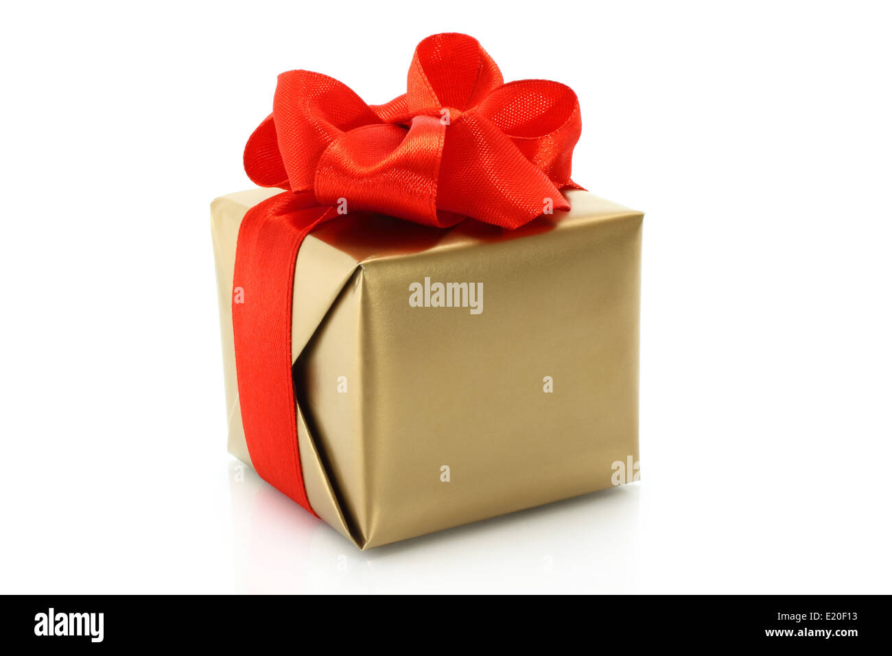 Gold present box with red bow on a white background Stock Photo - Alamy