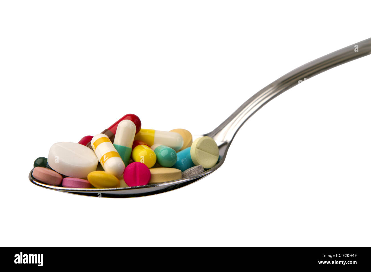 spoon full of tablets Stock Photo - Alamy