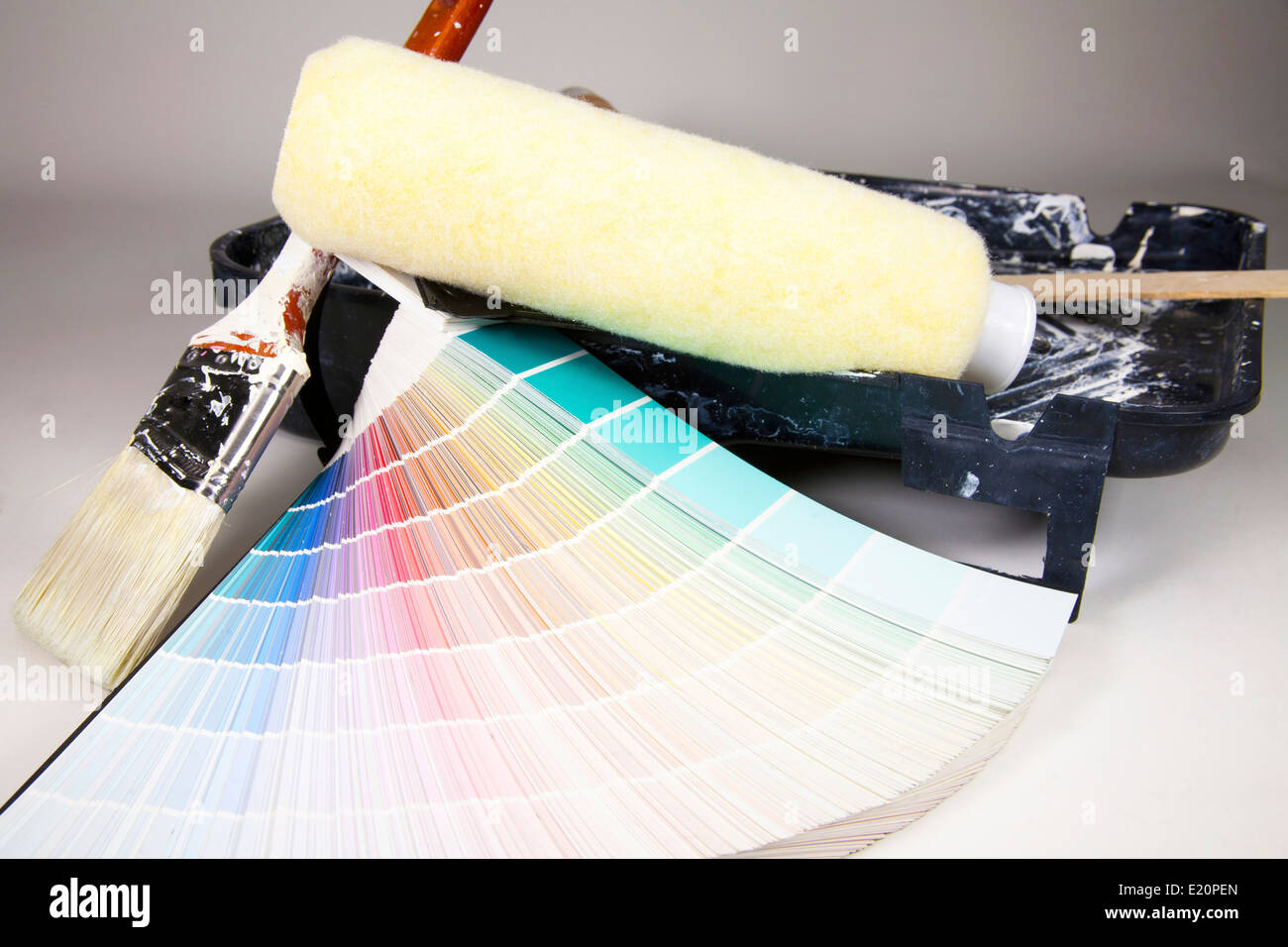 Paint brush, roller and pan, and color guide Stock Photo - Alamy