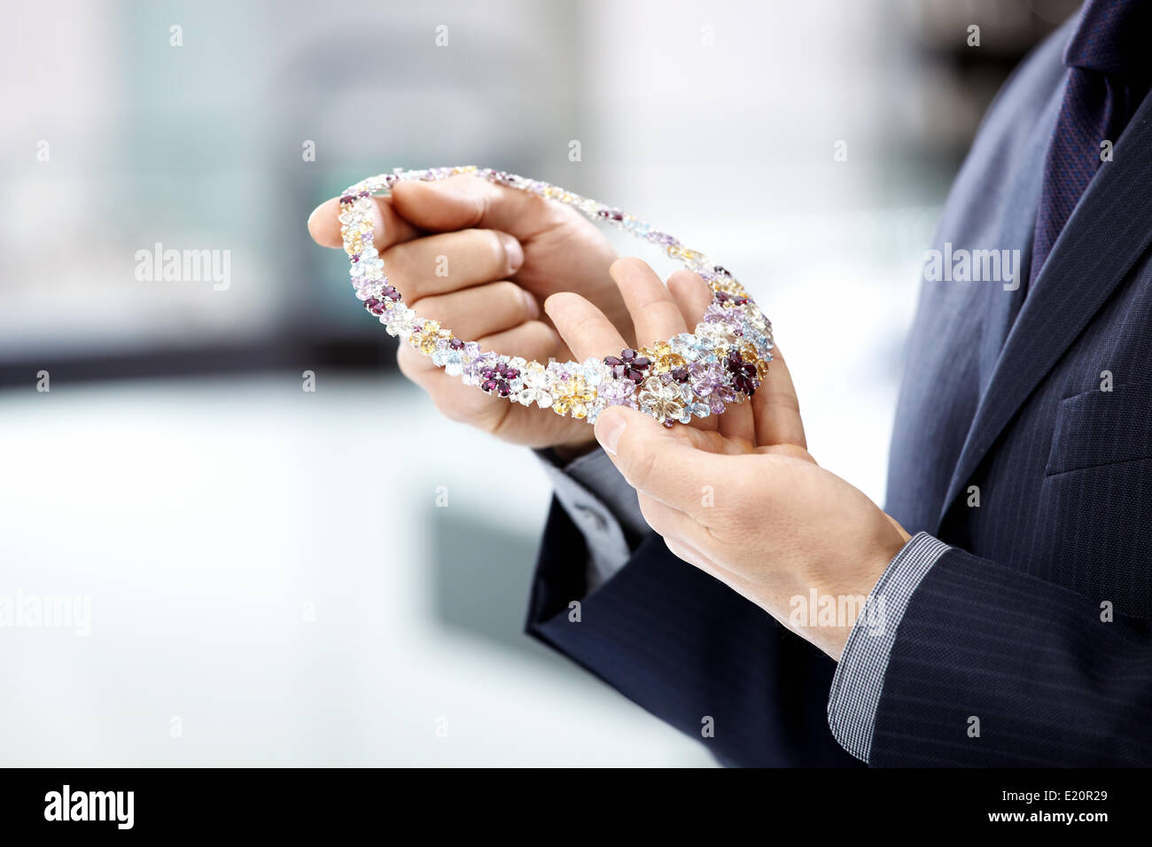Hands of the man hold a jewel Stock Photo - Alamy