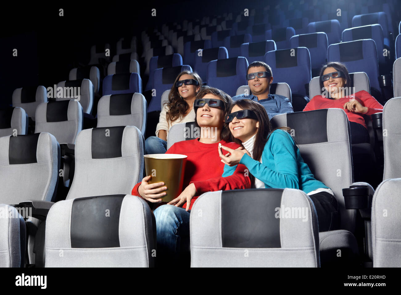 Smiling young people look cinema in 3d Stock Photo - Alamy