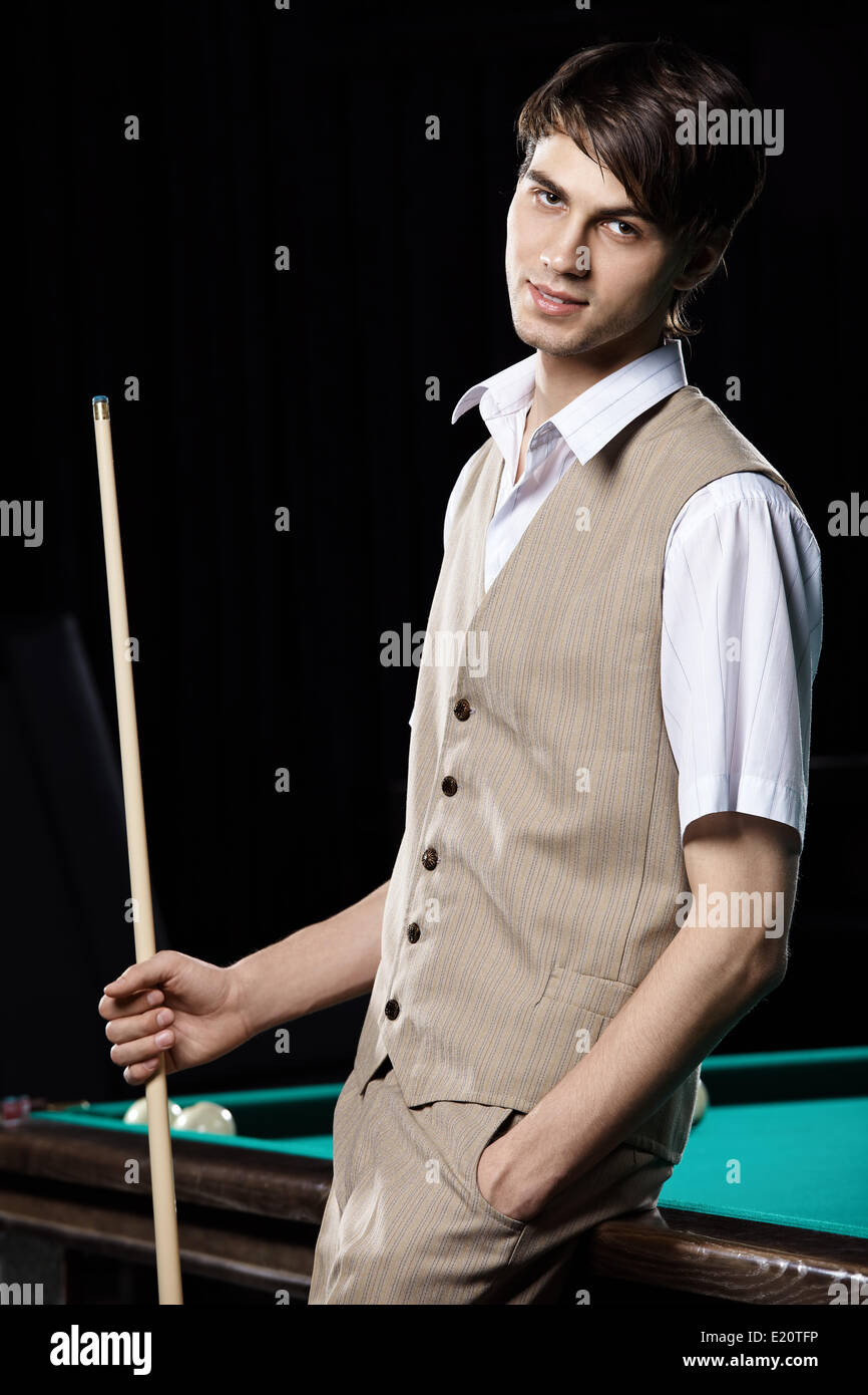 The man with cue Stock Photo - Alamy