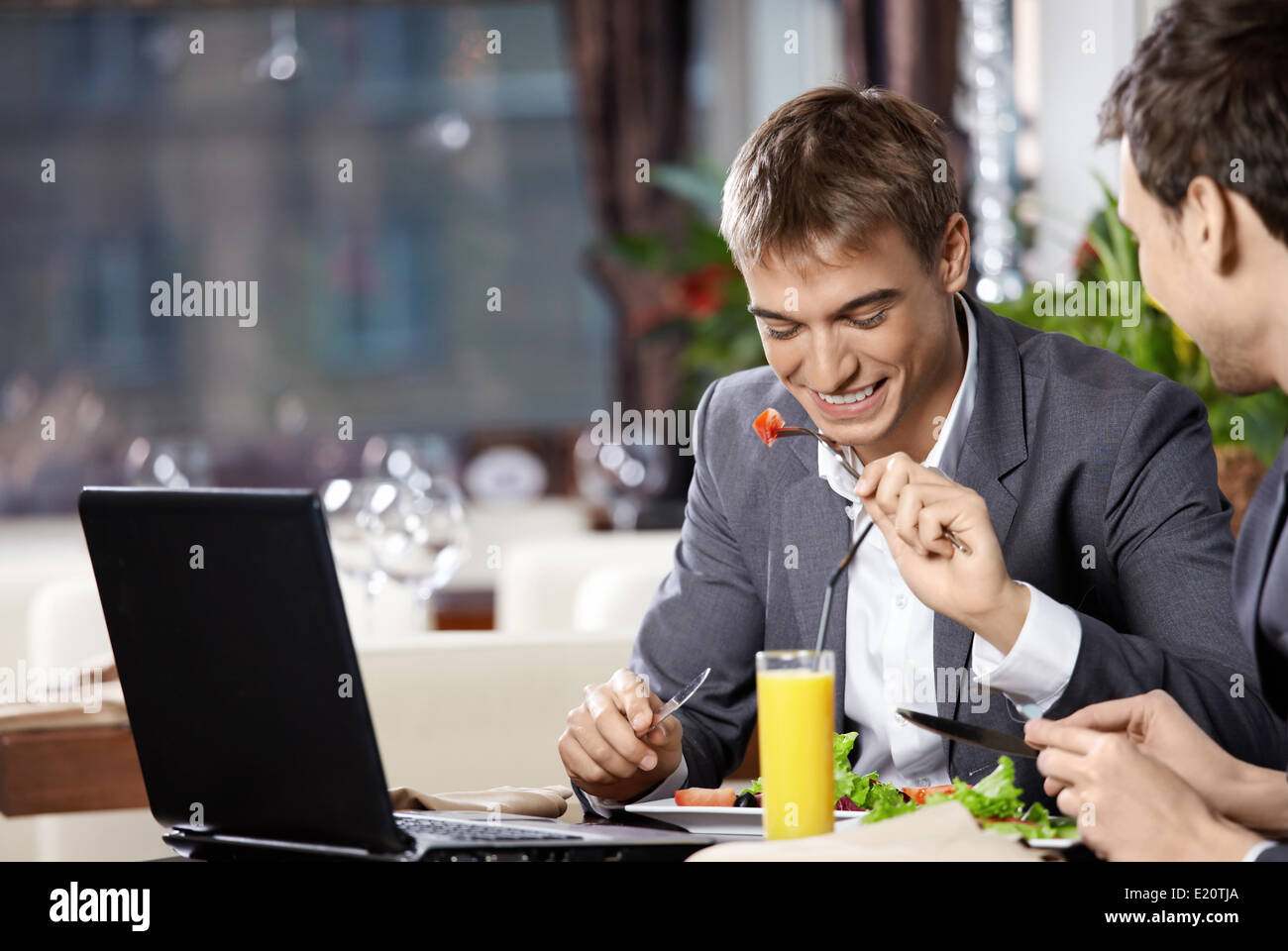 Two business men have dinner at restaurant Stock Photo - Alamy