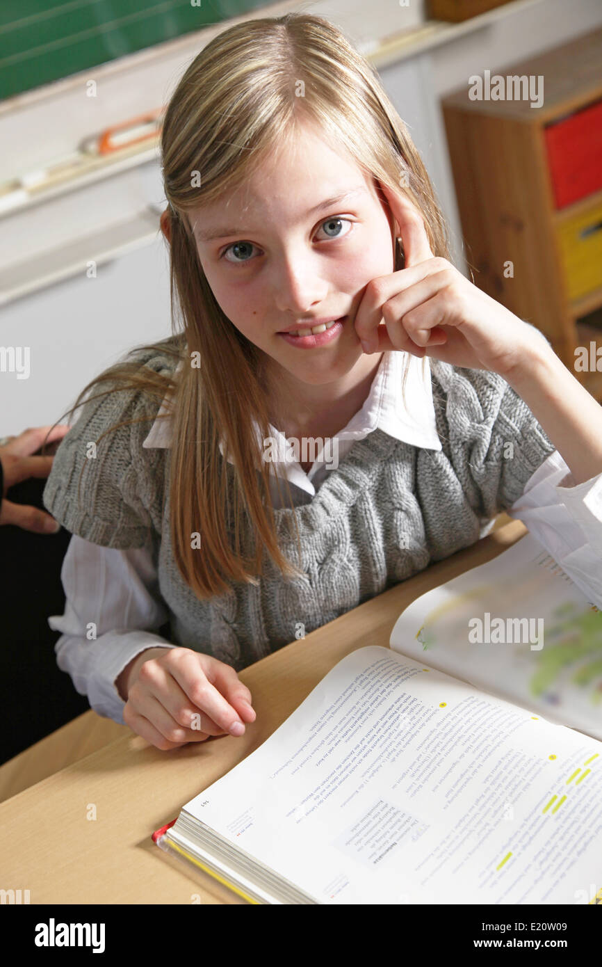 A child with a book in school Stock Photo - Alamy